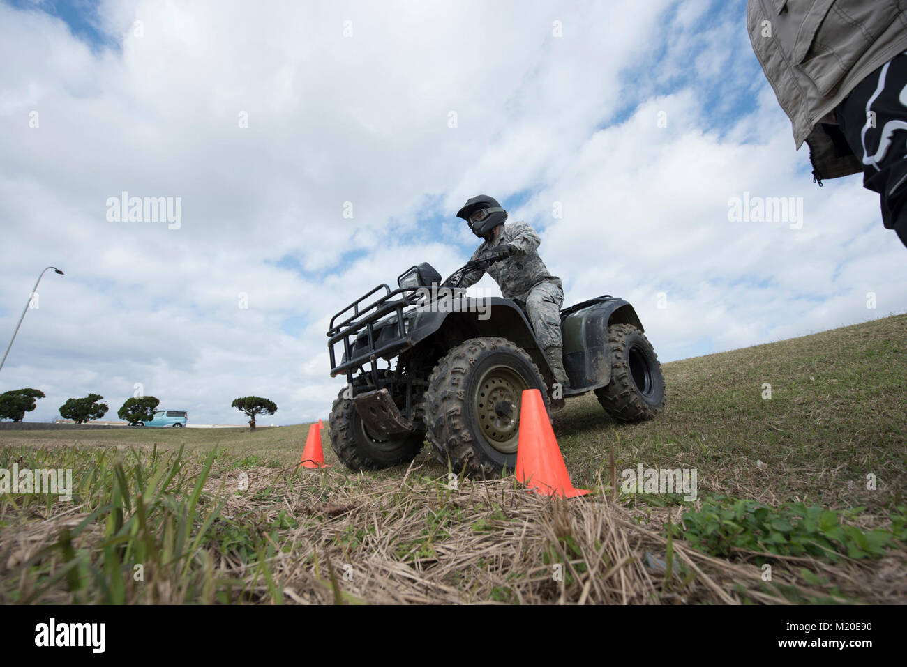 A U.S. Air Force Airman from the 18th Security Forces Squadron rides an ...