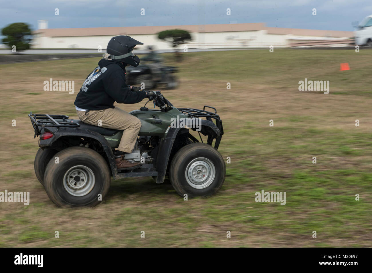 A U.S. Air Force Airman from the 18th Security Forces Squadron rides an ...