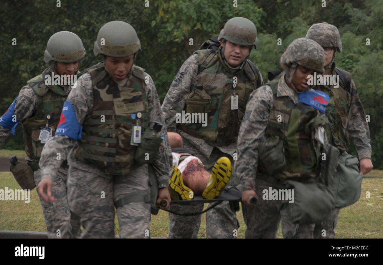 Members of the 18th Medical Group carry a simulated patient during ...