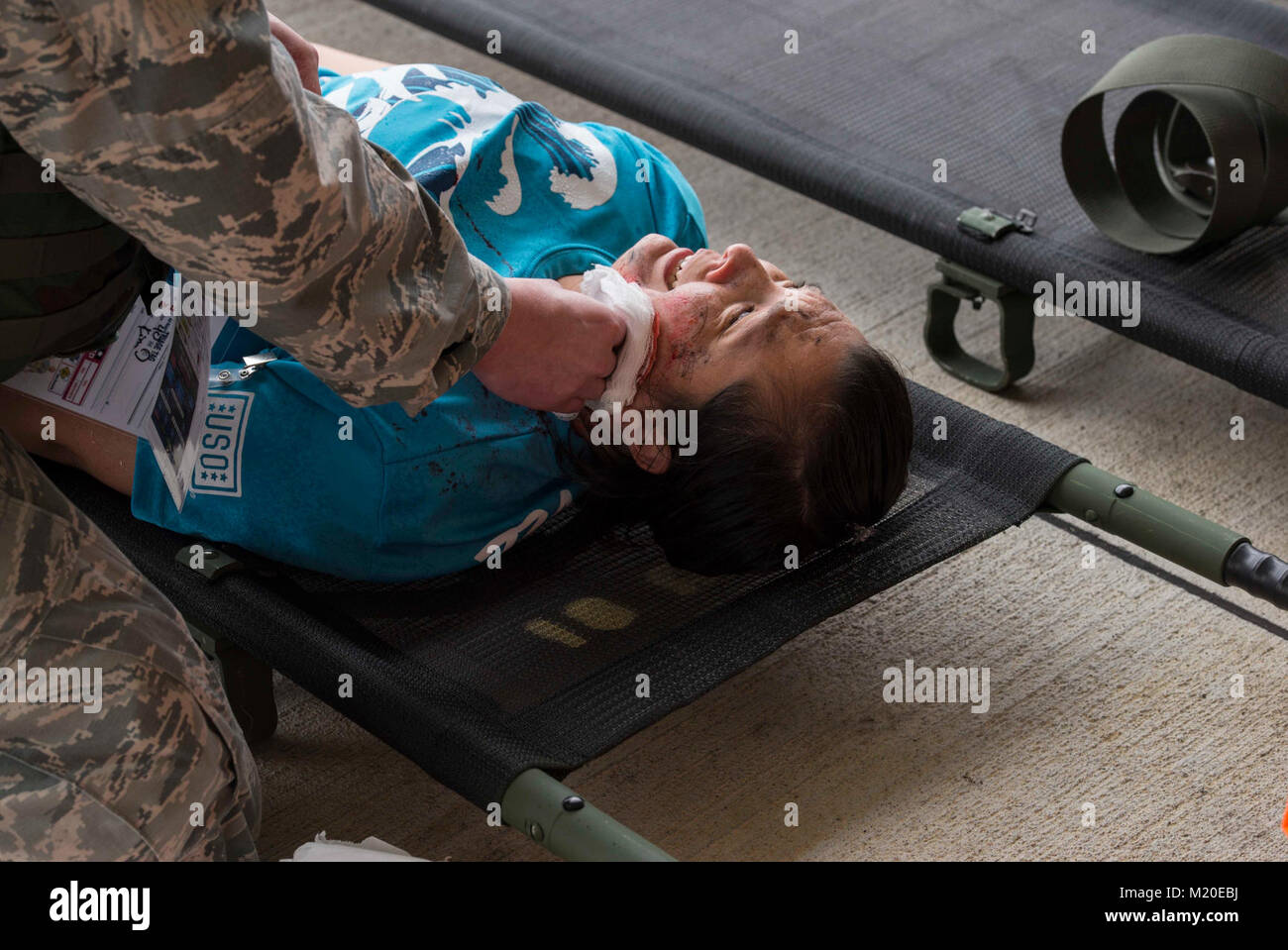 A simulated patient is treated during a joint field training exercise ...
