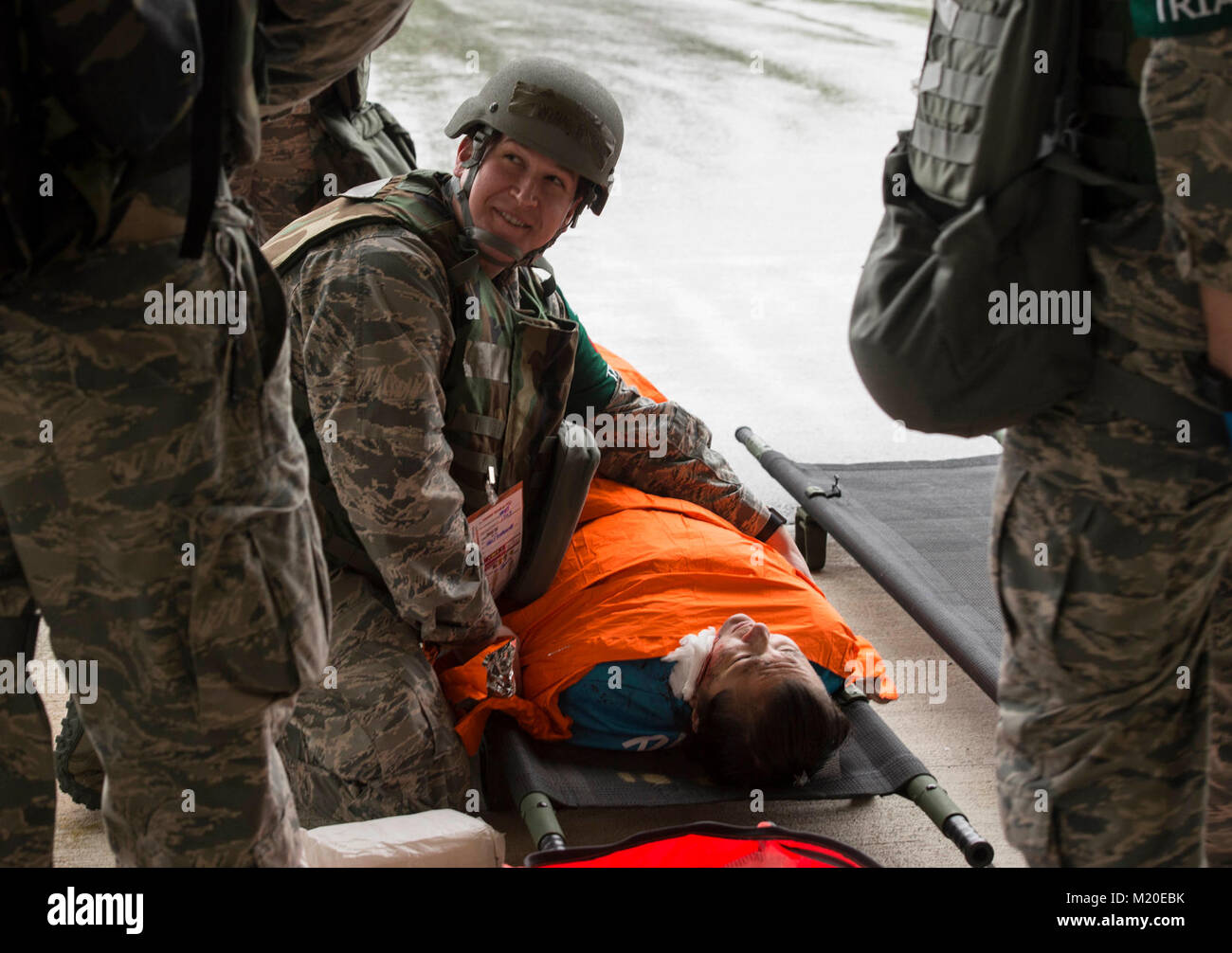 A simulated patient is treated during a joint field training exercise ...