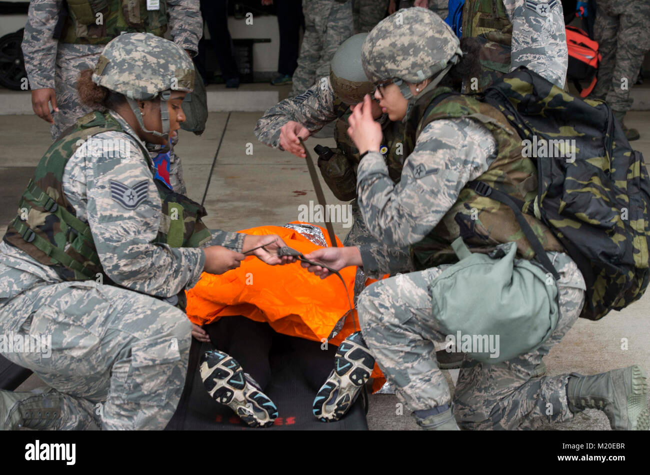 A simulated patient is treated during a joint field training exercise ...
