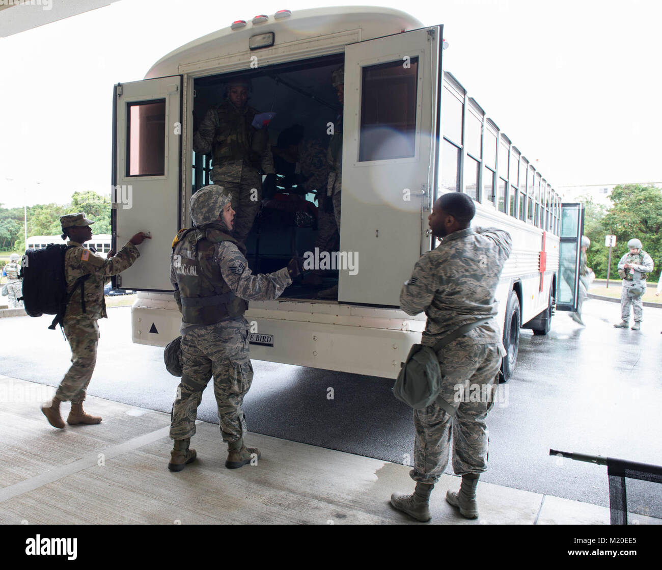 A U.S. Army member works alongside U.S. Air Force members to close the ...