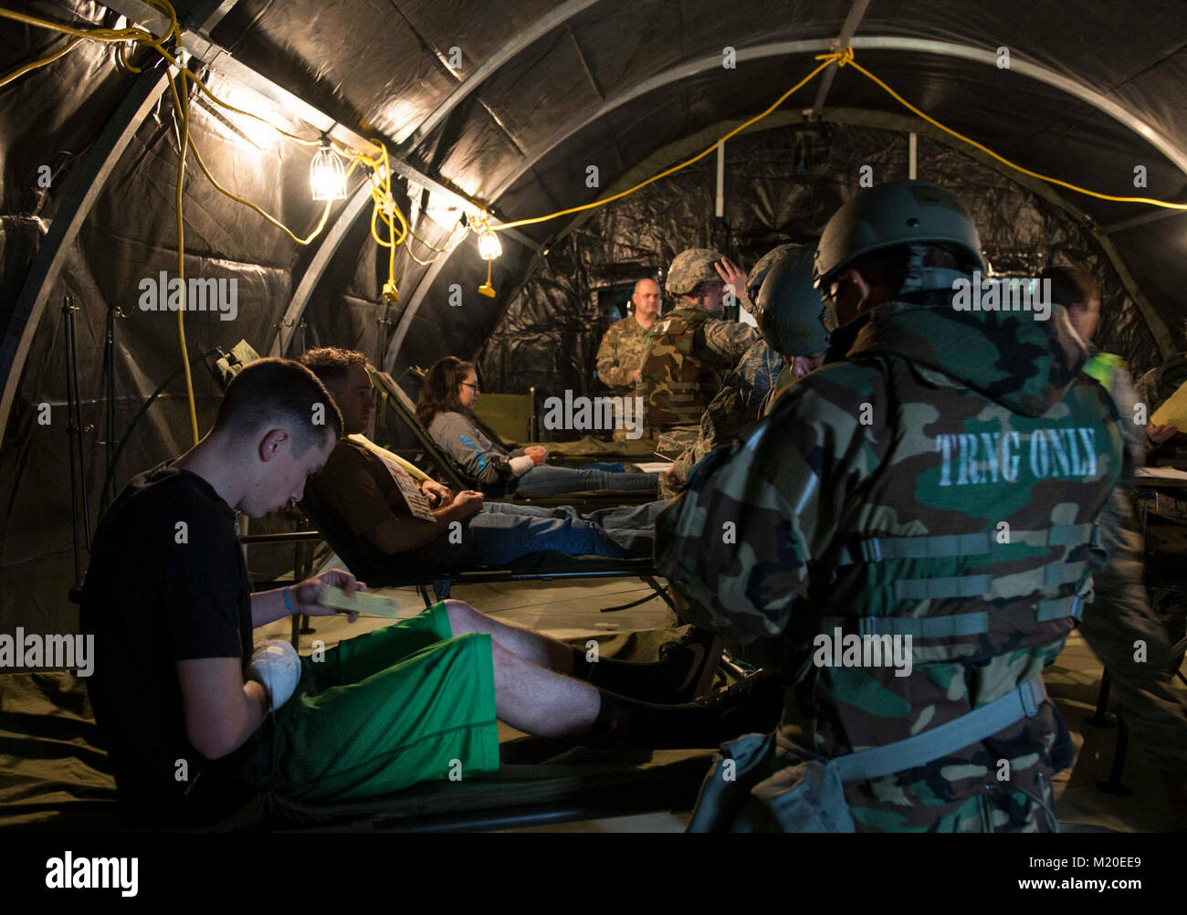 Volunteers recieve simulated medical care in an En Route Patient ...