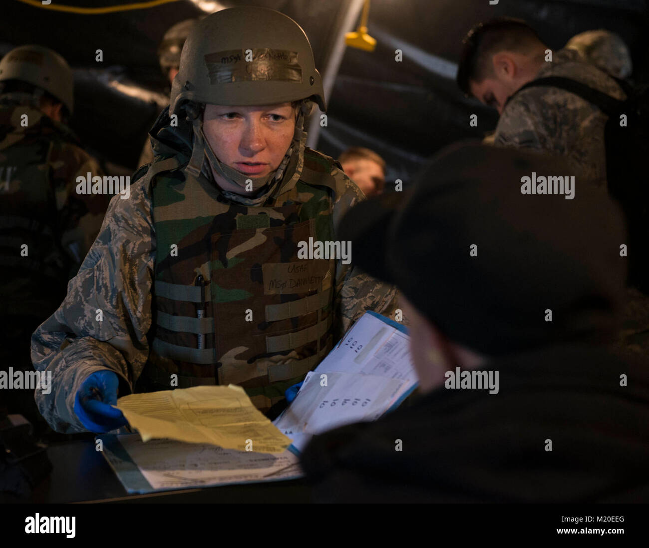 Volunteers recieve simulated medical care in an En Route Patient ...