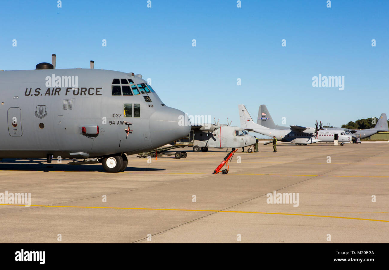 An assortment of aircraft from different countries are parked on the ...