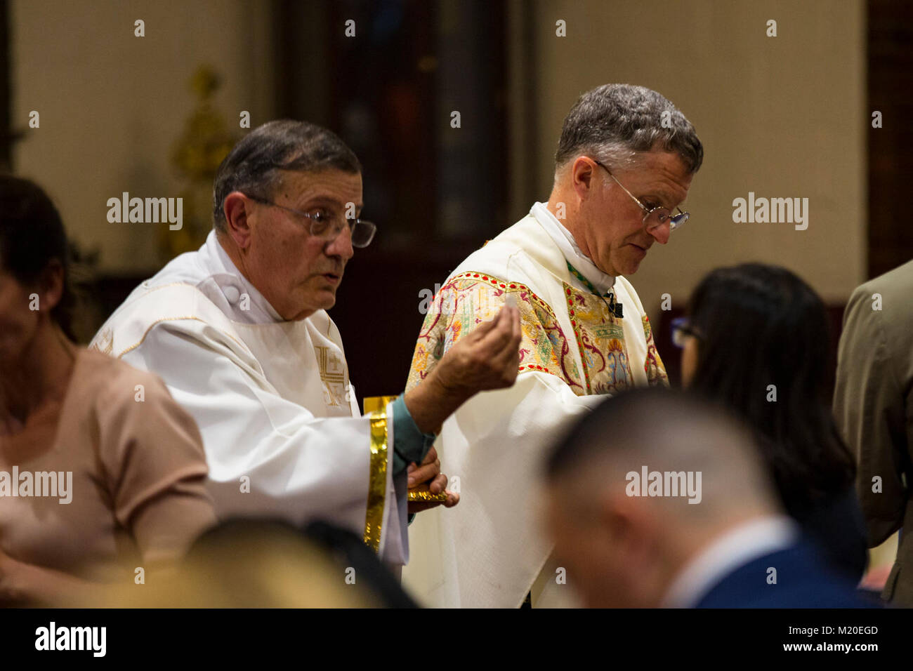 U.S. Marines and civilians attend a mass at the St. Francis Xavier ...