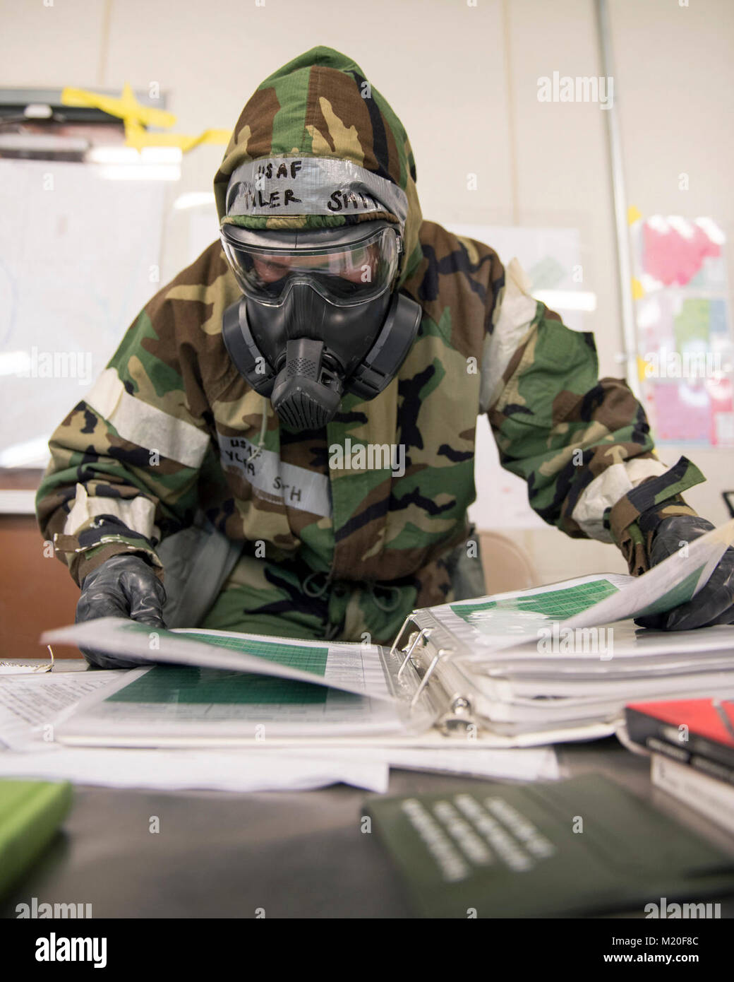 An Airman assigned to the 60th Air Mobility Wing dons Mission Oriented ...