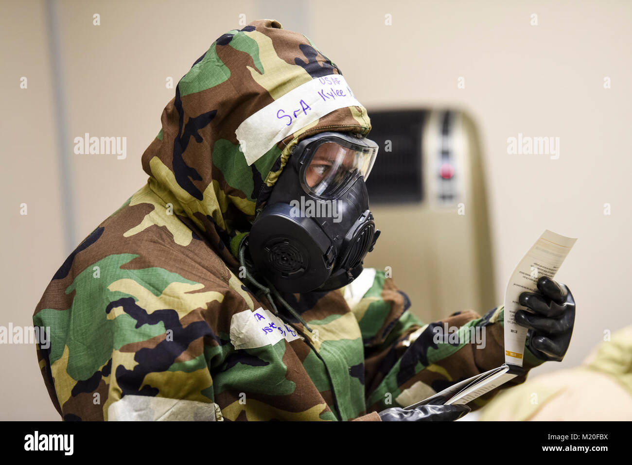 An Airman assigned to the 60th Air Mobility Wing dons Mission Oriented ...