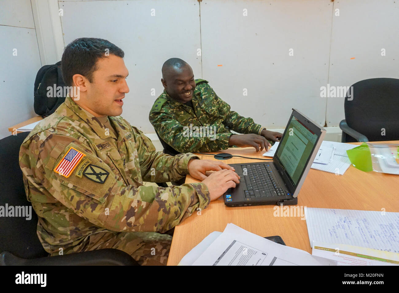 Cpt. Dimitri Facaros, U.S. Army Africa legal officer, and Lt. Lambert ...
