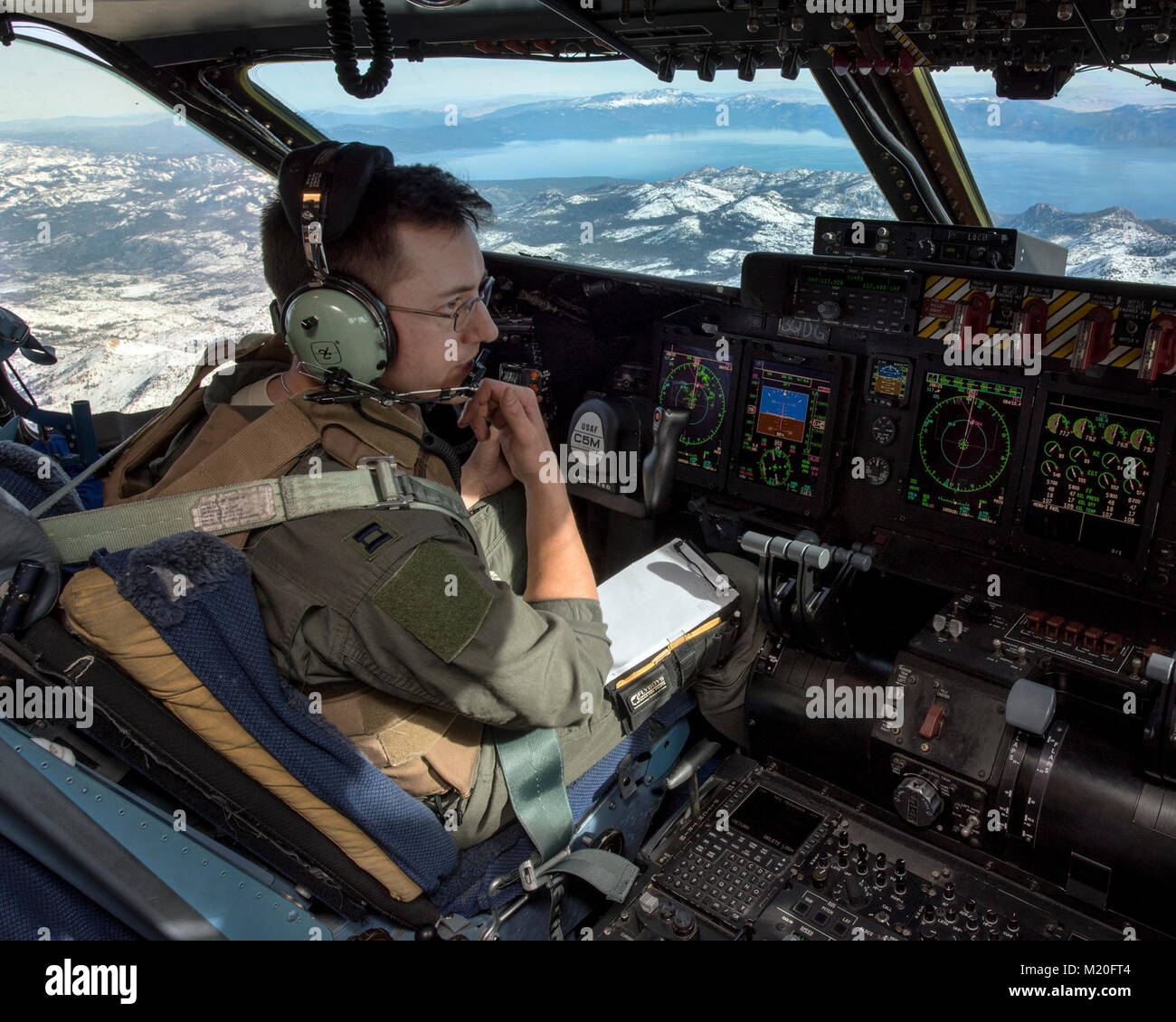 An aircrew member assigned to the 22nd Airlift Squadron flies in ...