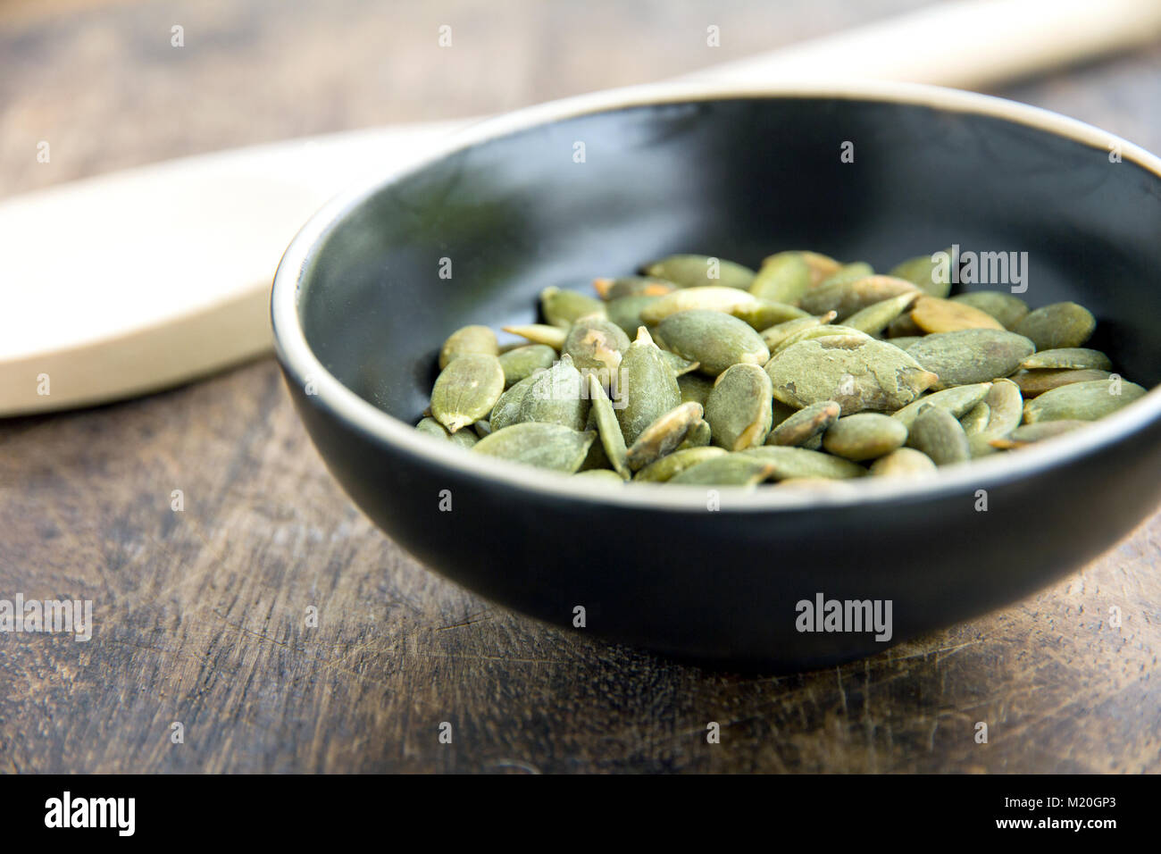 Pumpkin seeds background Stock Photo - Alamy