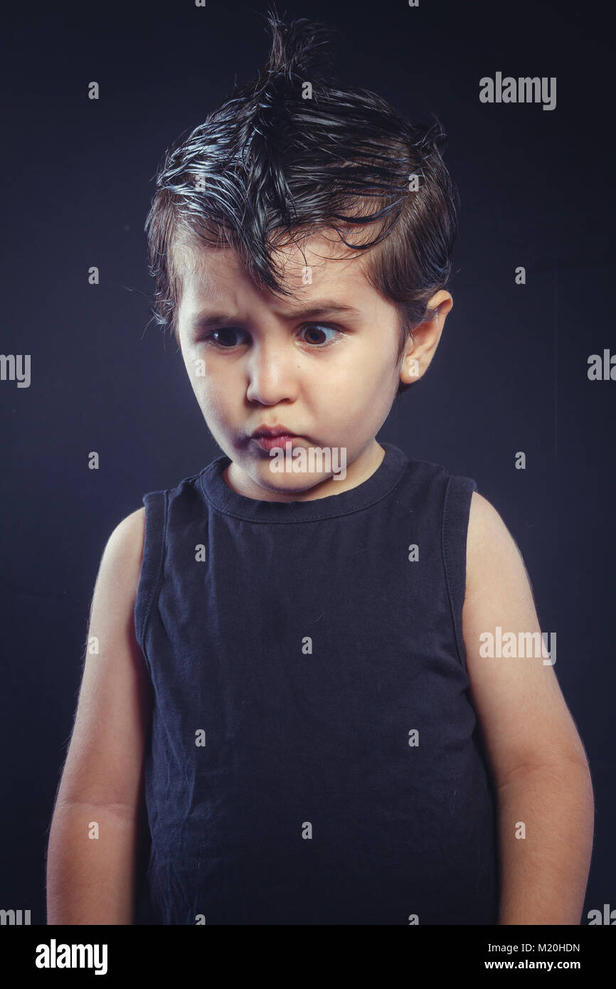 boy with slicked-back hair, funny and expressive Stock Photo - Alamy
