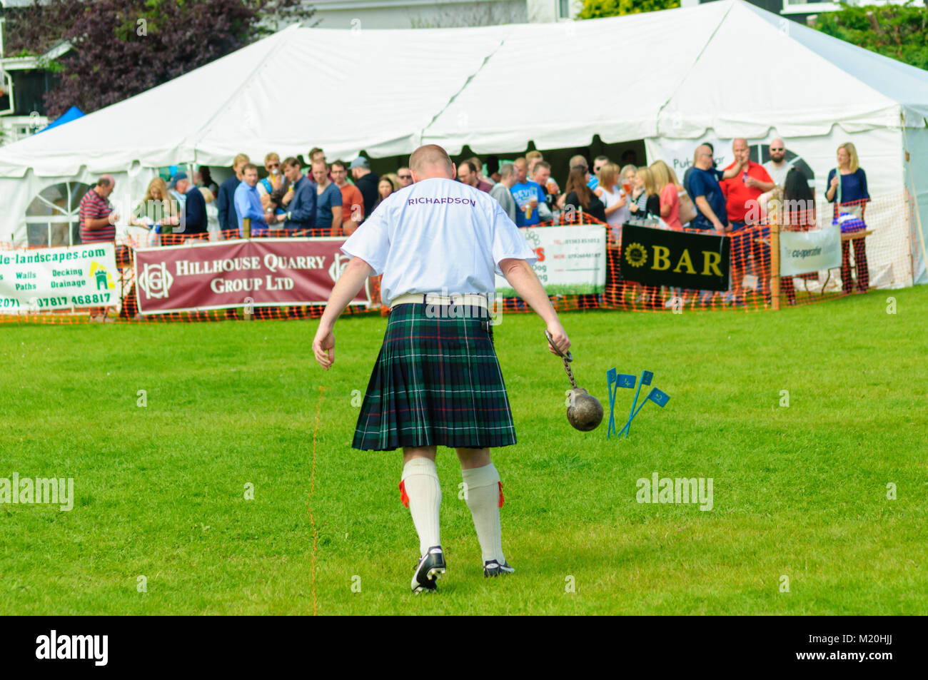 Male prepares to compete in the weight throw competition at the ...
