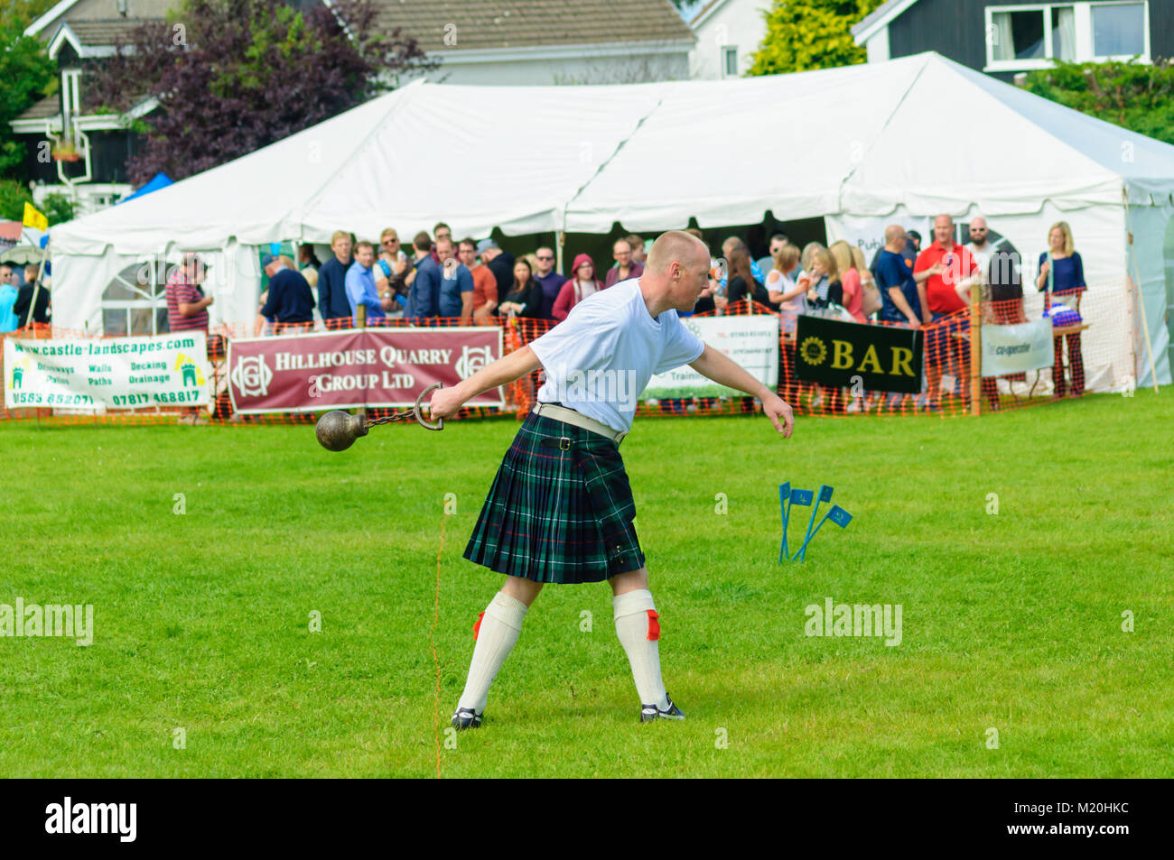 Male prepares to compete in the weight throw competition at the ...