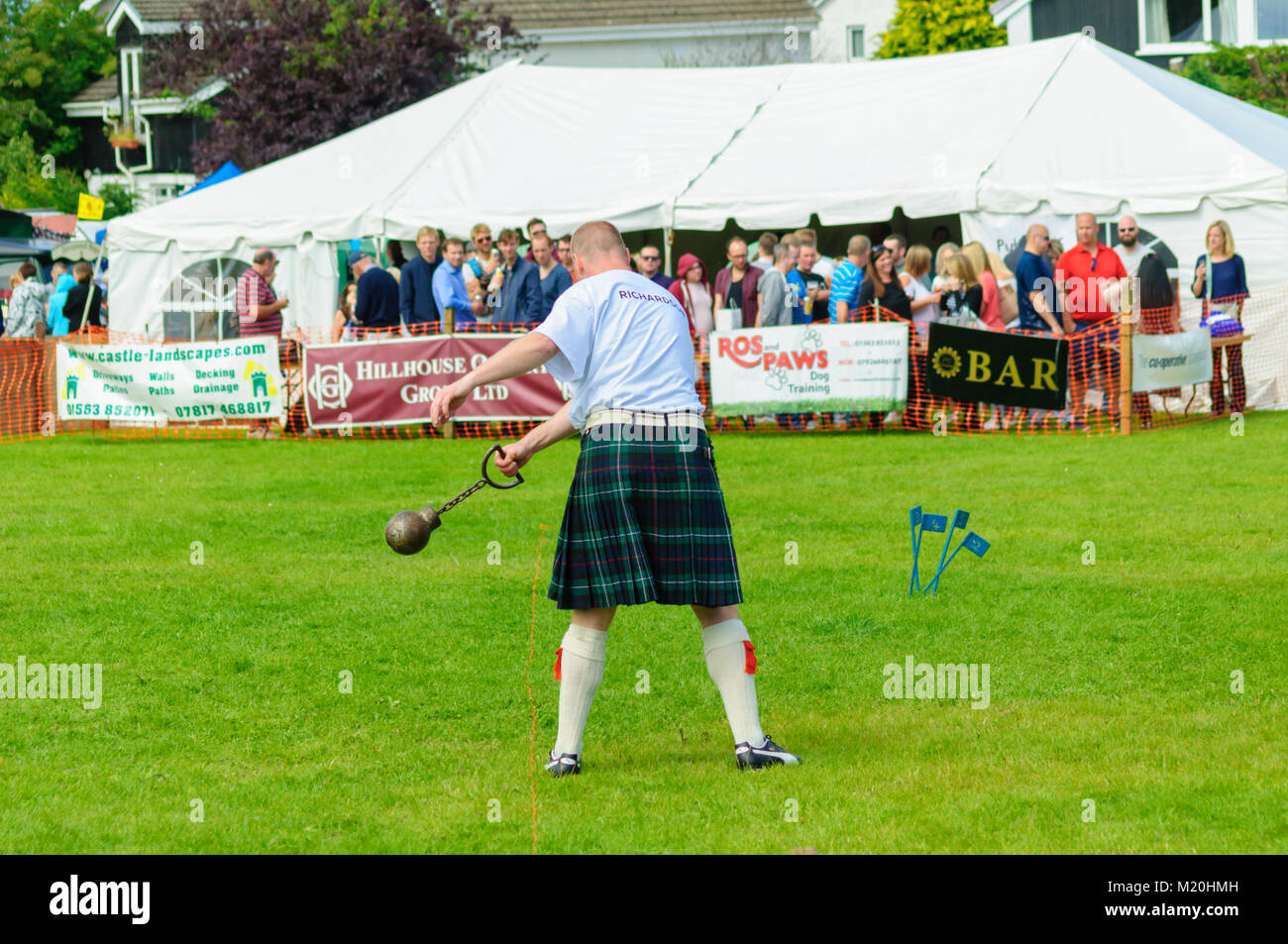Male prepares to compete in the weight throw competition at the ...