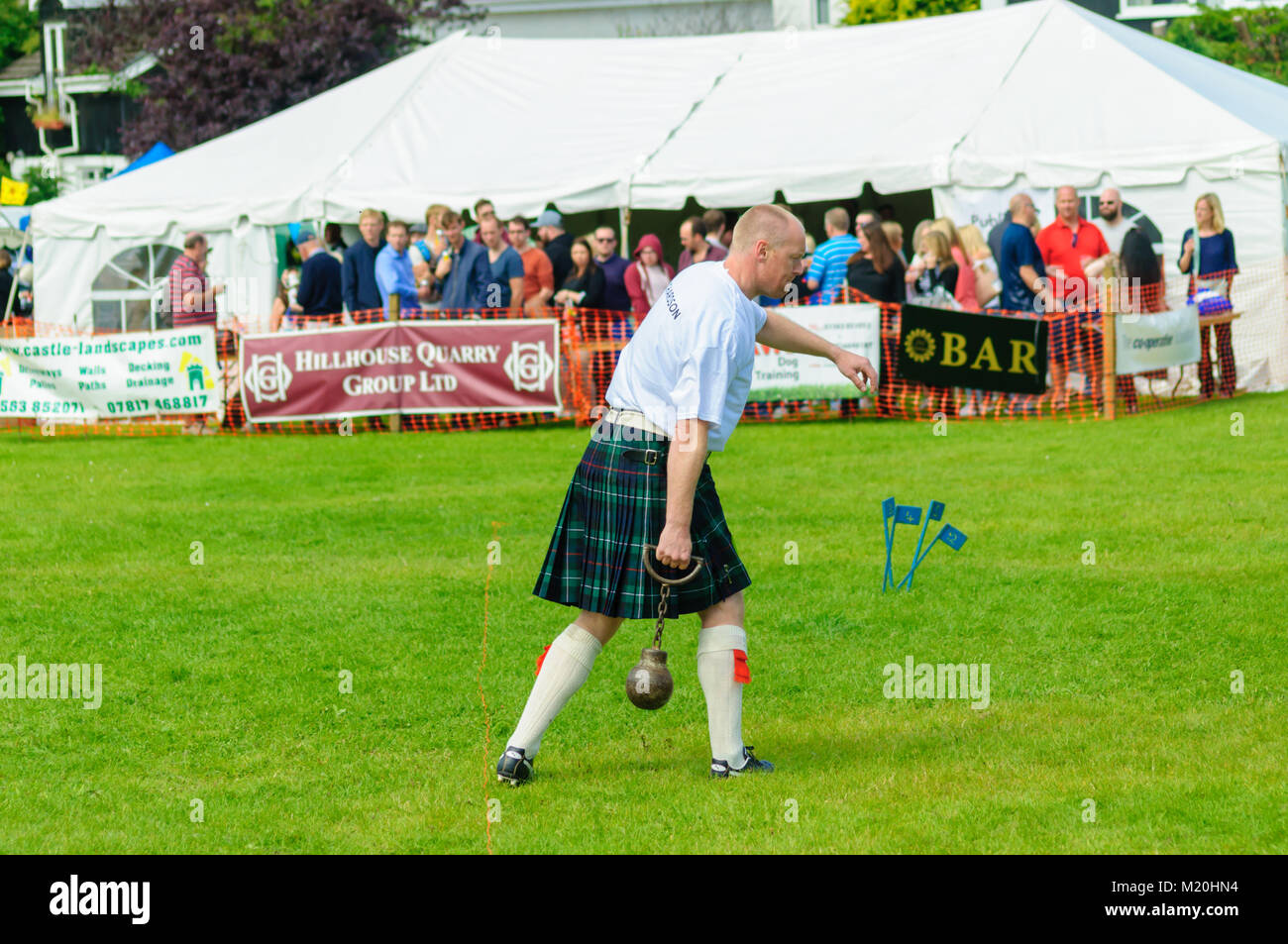 Male prepares to compete in the weight throw competition at the ...