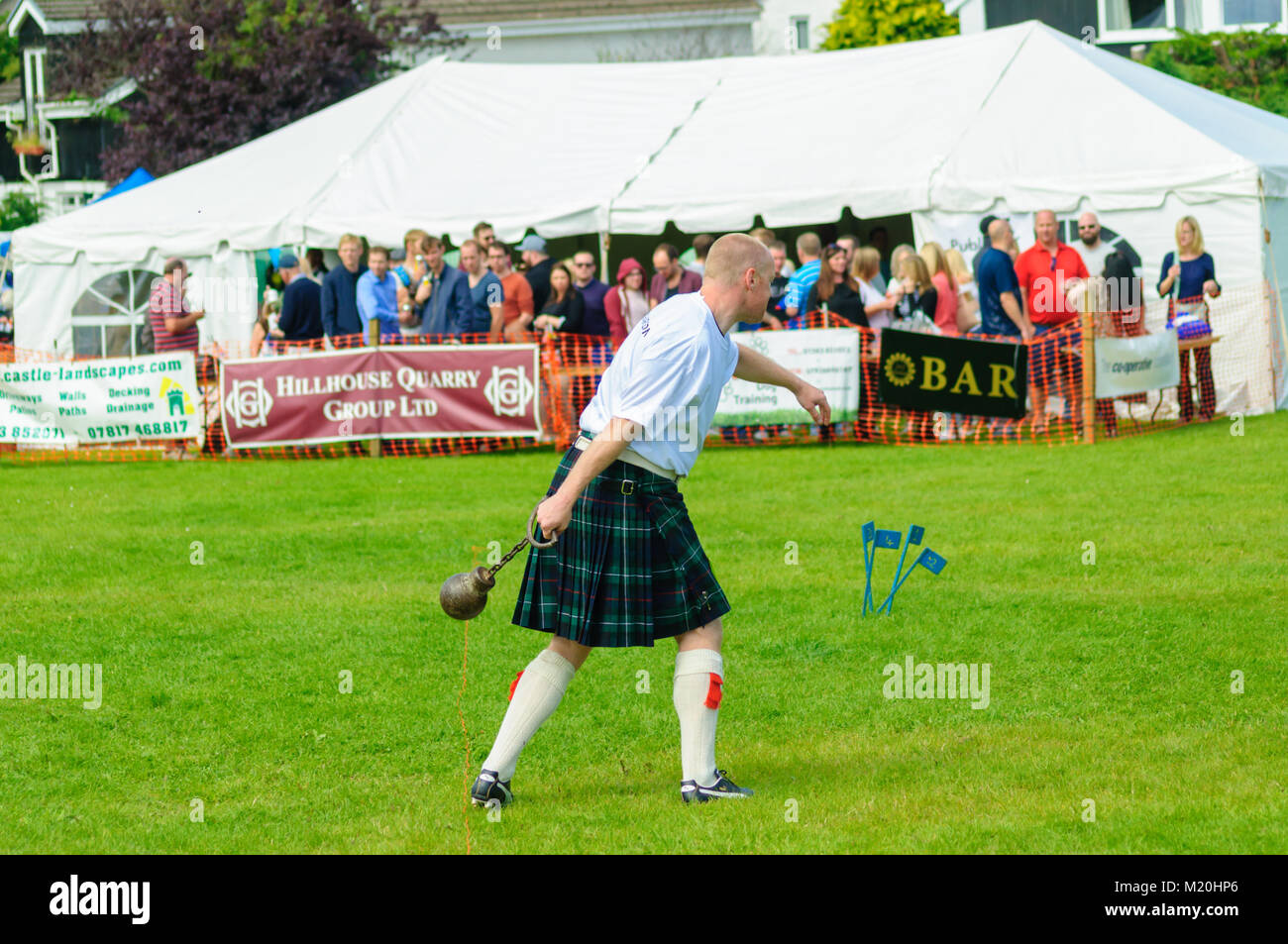 Male prepares to compete in the weight throw competition at the ...