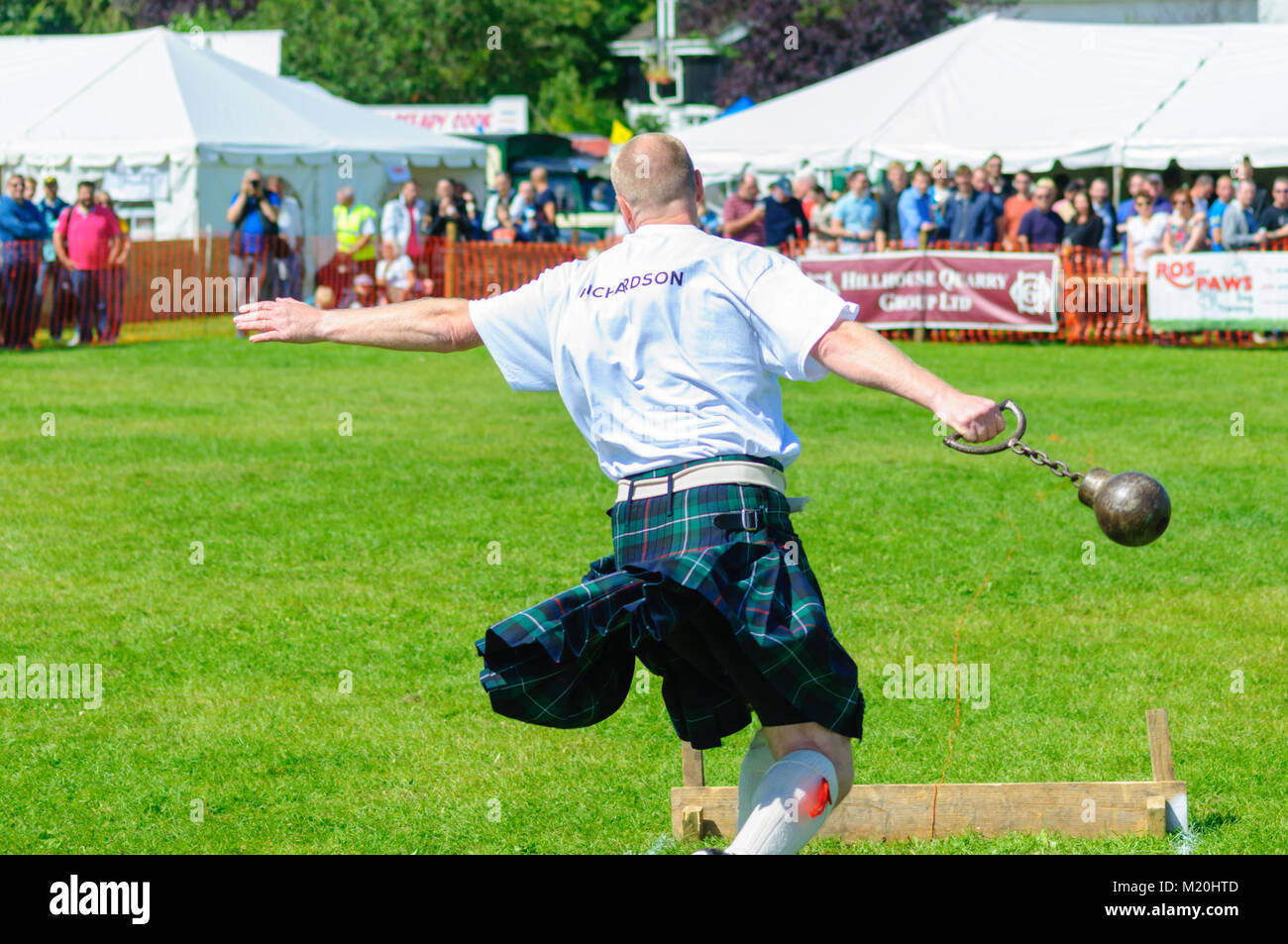 Male prepares to compete in the weight throw competition at the ...