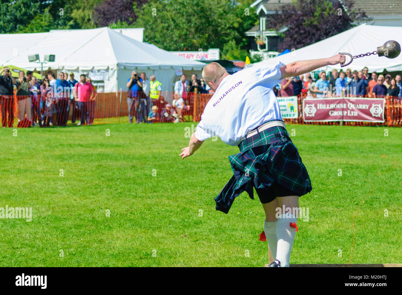 Male prepares to compete in the weight throw competition at the ...