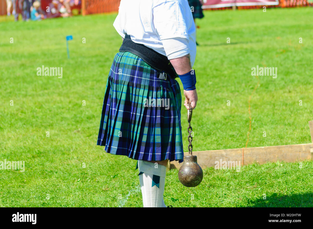 Male prepares to compete in the weight throw competition at the ...