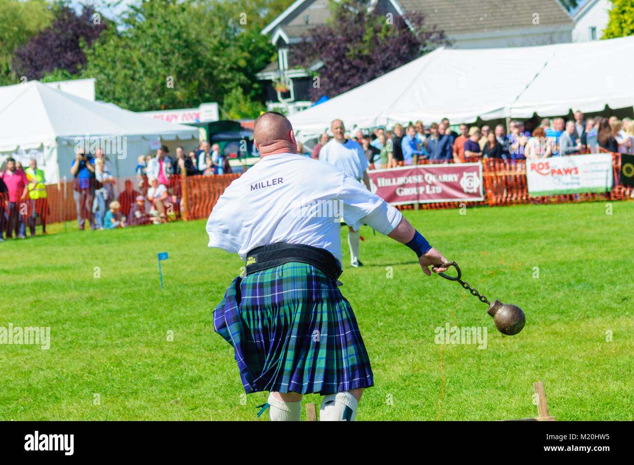 Male prepares to compete in the weight throw competition at the ...