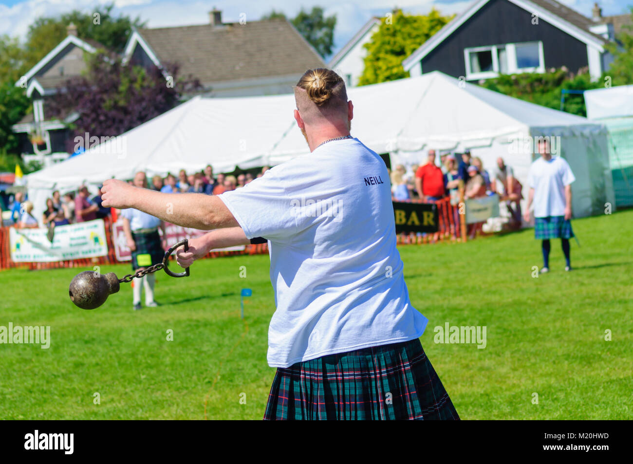 Male prepares to compete in the weight throw competition at the ...