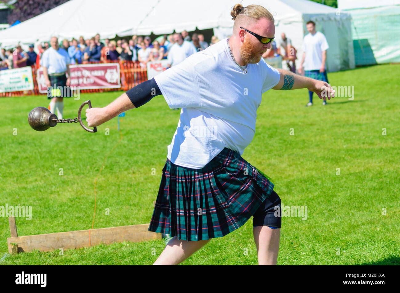 Male prepares to compete in the weight throw competition at the ...