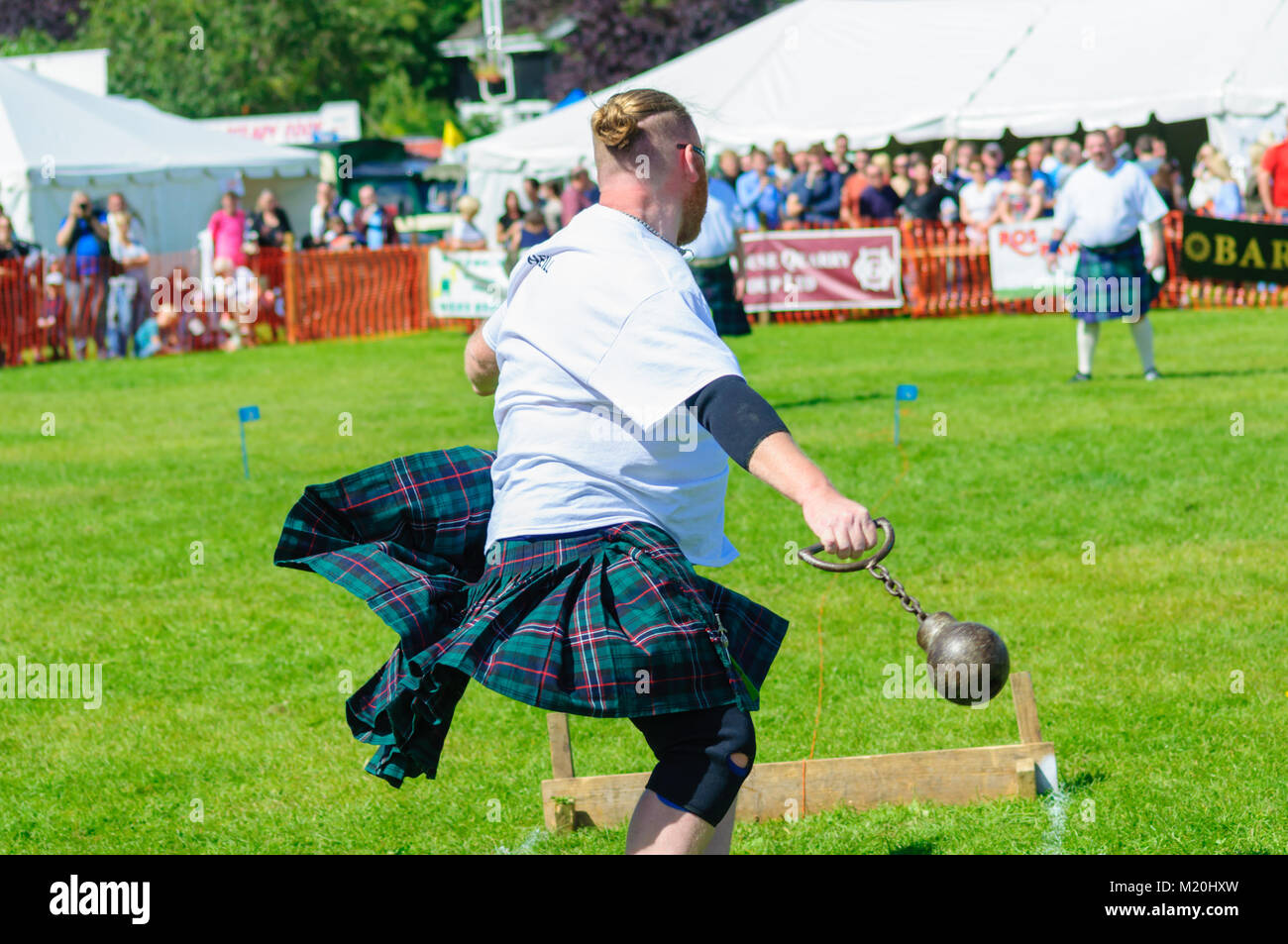 Male prepares to compete in the weight throw competition at the ...