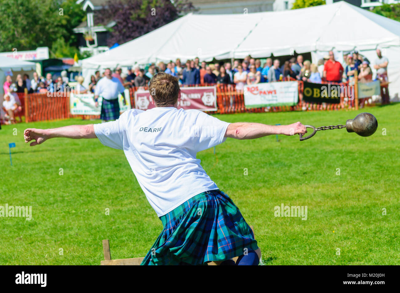 Male prepares to compete in the weight throw competition at the ...