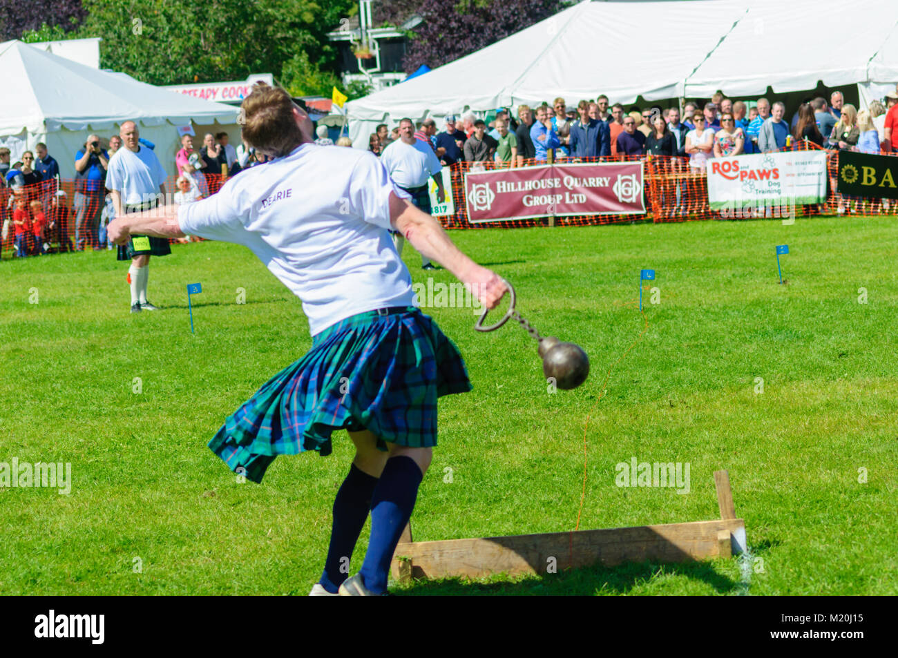 Male prepares to compete in the weight throw competition at the ...