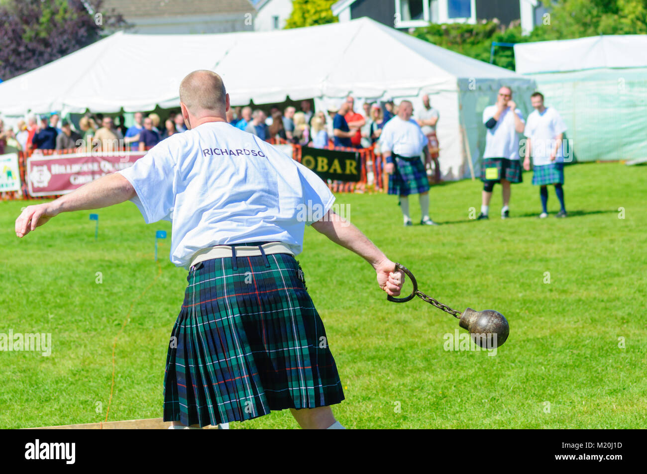 Male prepares to compete in the weight throw competition at the ...