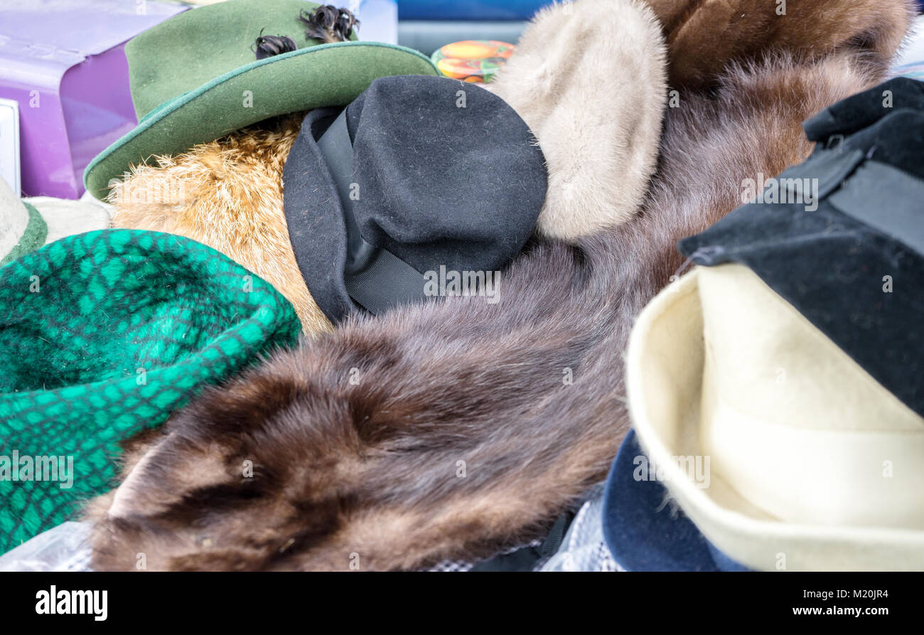 Various hats made of felt, fabric and fur at a flea market Stock Photo ...