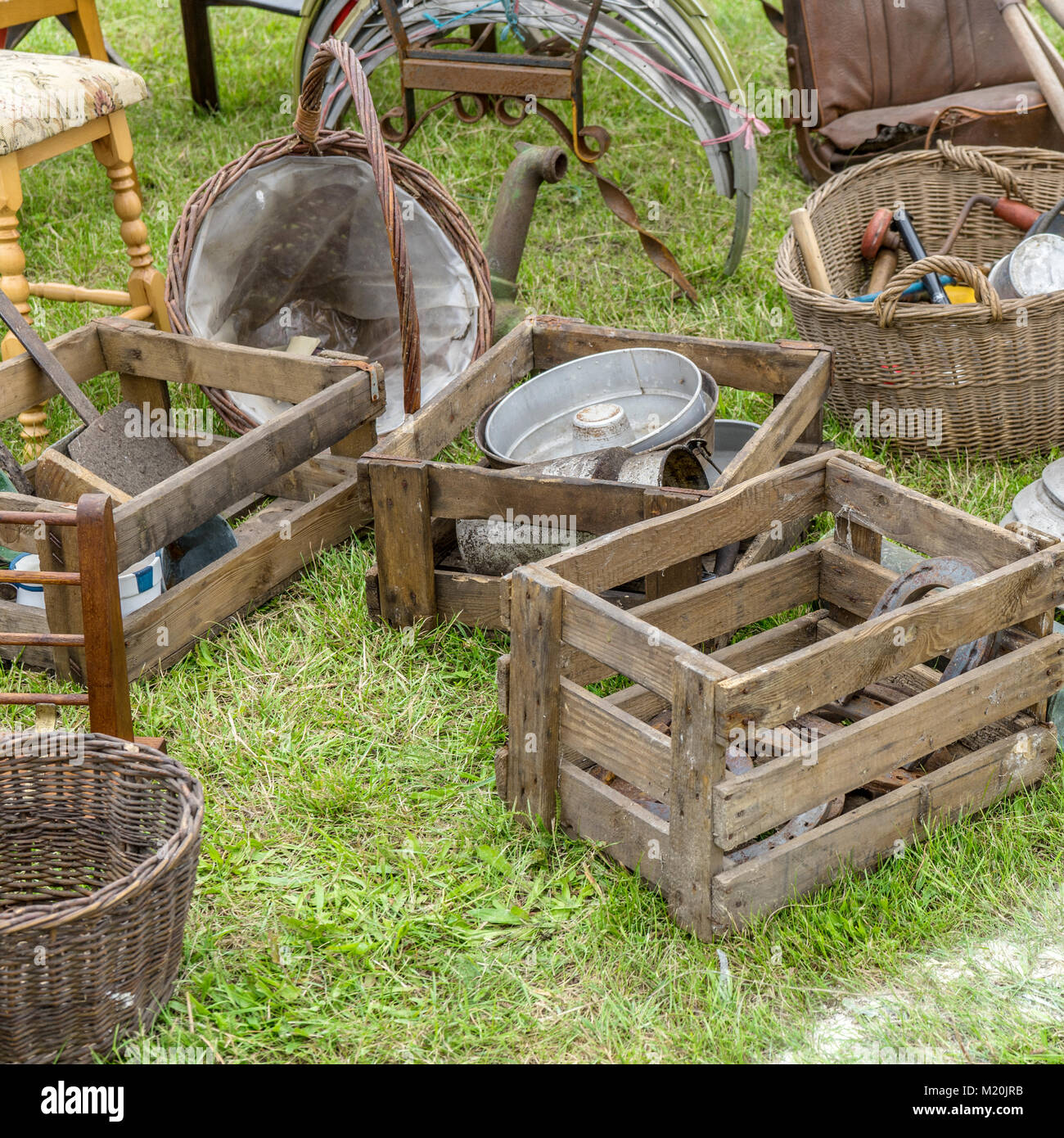 Crates, baskets, furniture and household items at a flea market Stock ...