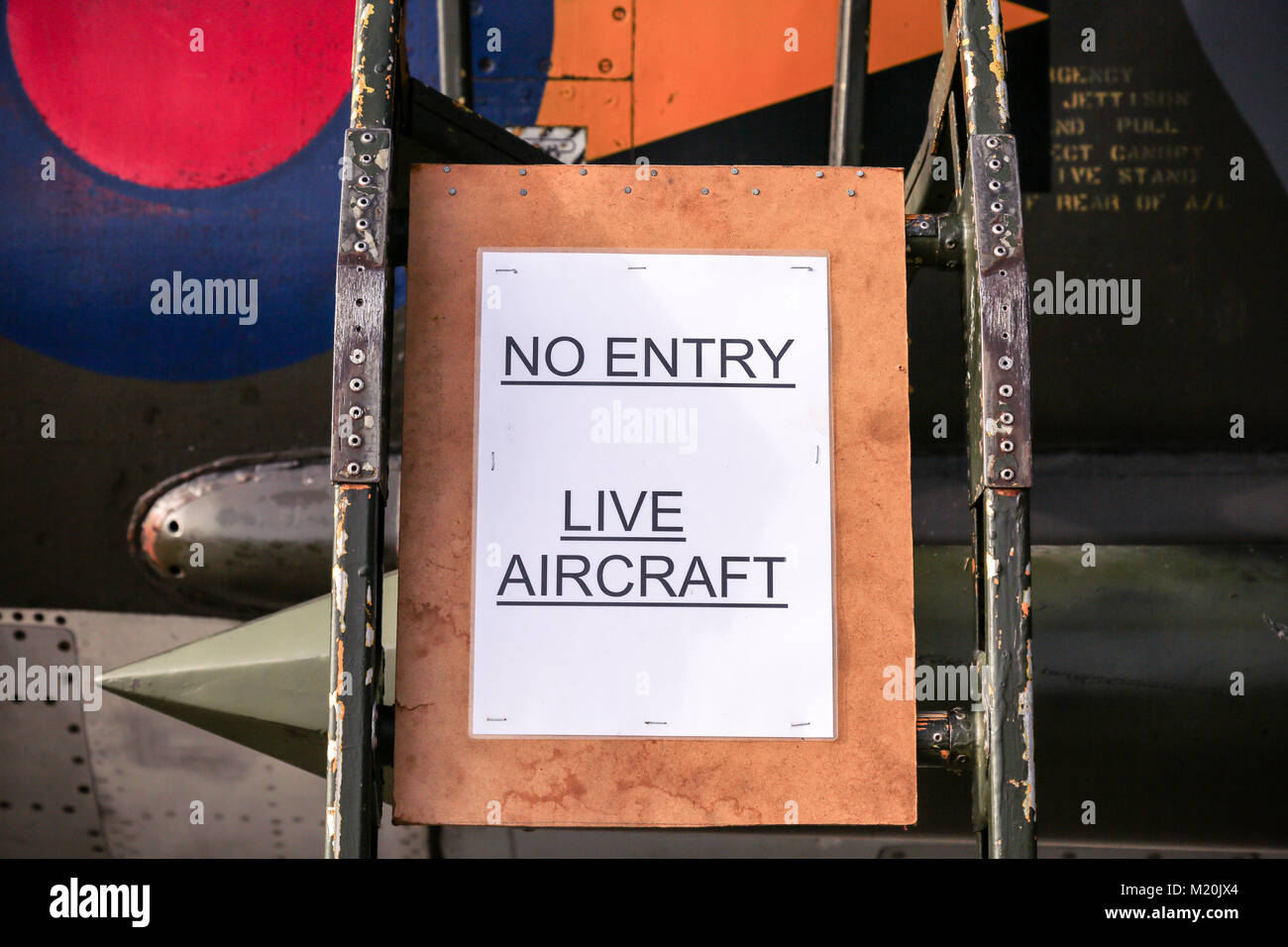 A warning sign on the steps to an aircraft Stock Photo - Alamy