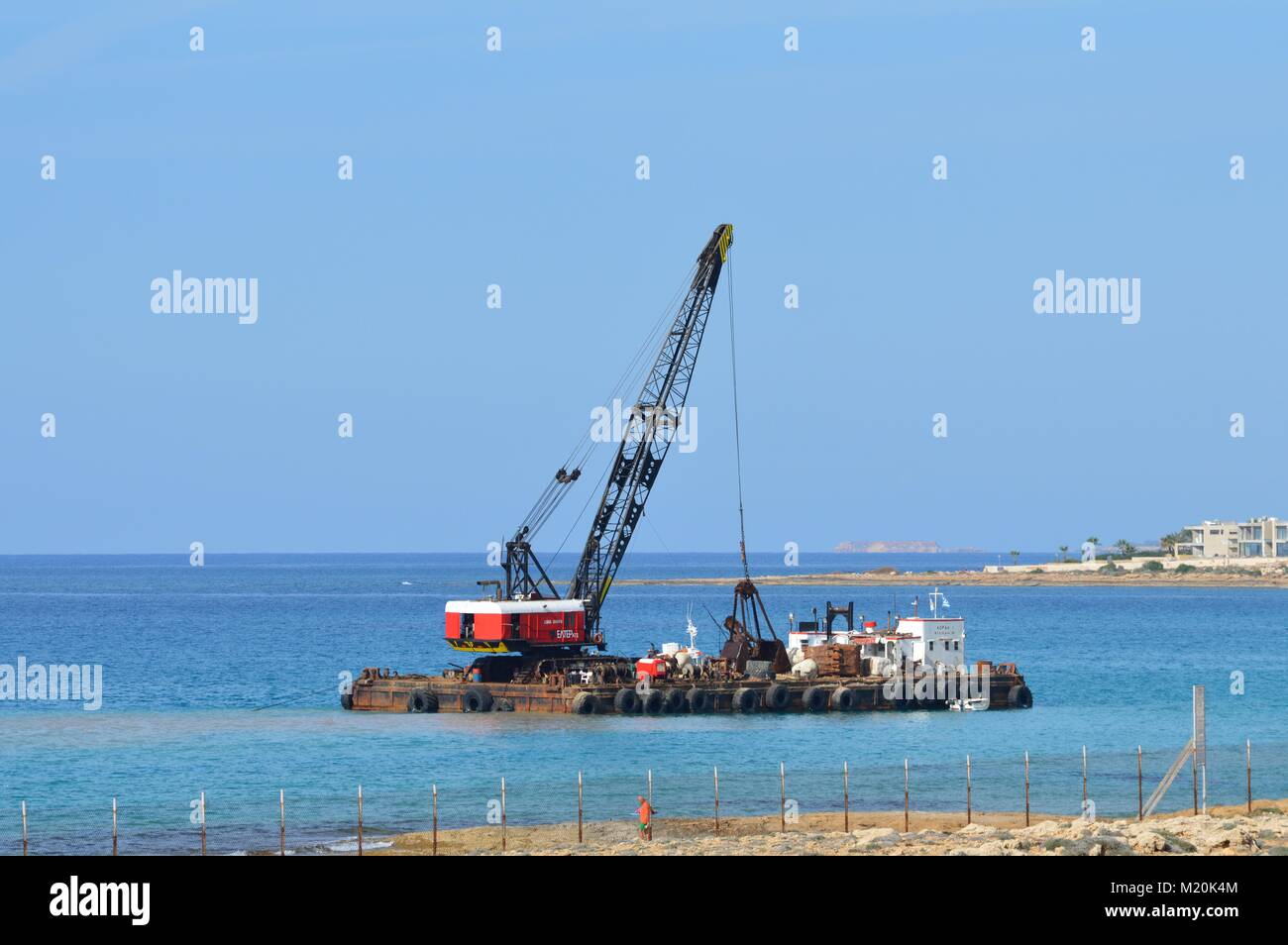 Ocean barge dredging harbour entrance at Paphos in Cyprus Stock Photo ...