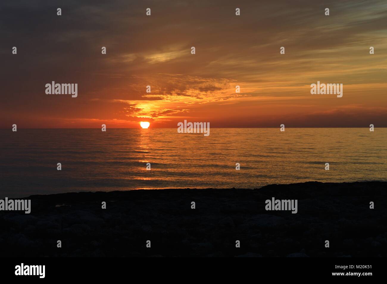 Golden sunset along Paphos seashore in Cyprus during November Stock ...