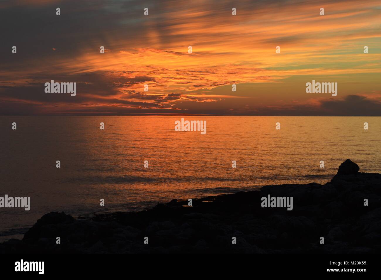 Golden sunset along Paphos seashore in Cyprus during November Stock ...