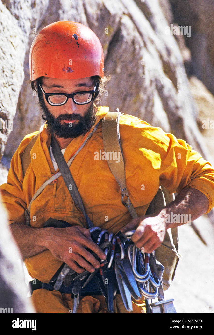Portrait of rock climber Reed Cundif, on a steep cliff face in the ...