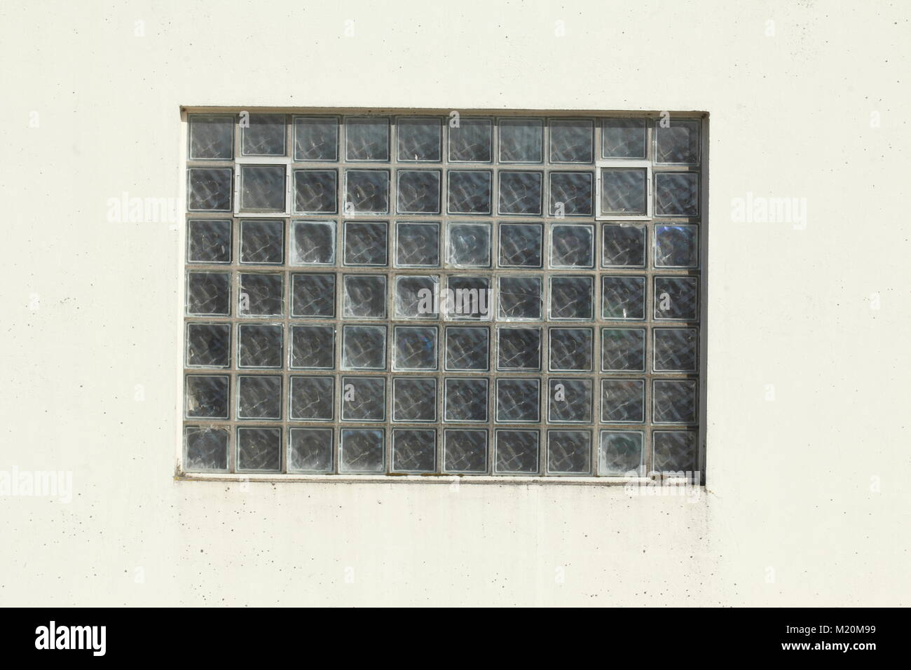 Tile window on white concrete house wall Stock Photo - Alamy