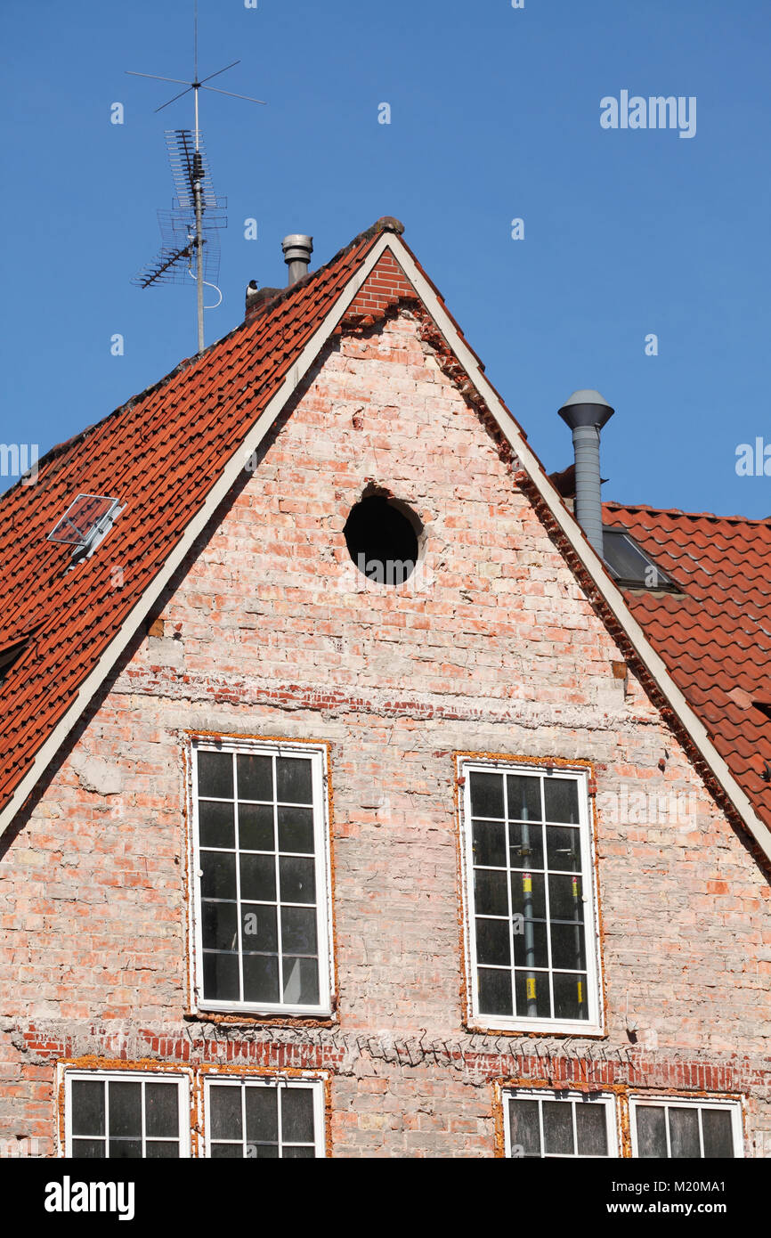 Old House roof gable with Windows from brick Stock Photo - Alamy