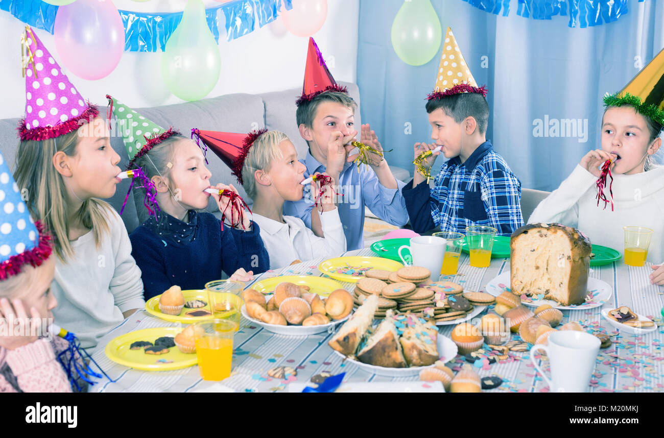 positive children having good time during friend’s birthday party Stock ...
