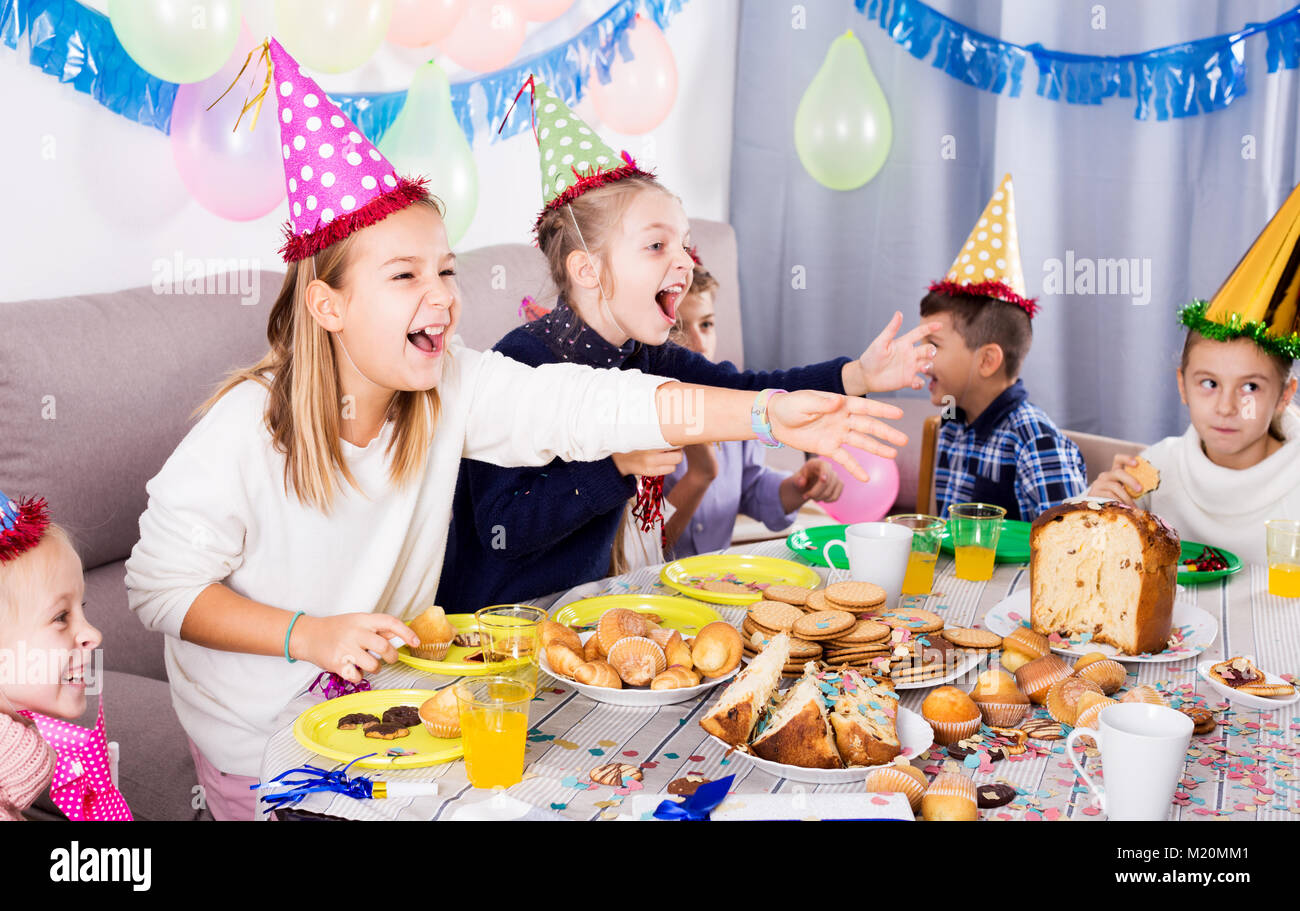 Happy group of children having fun during friend’s birthday party Stock ...