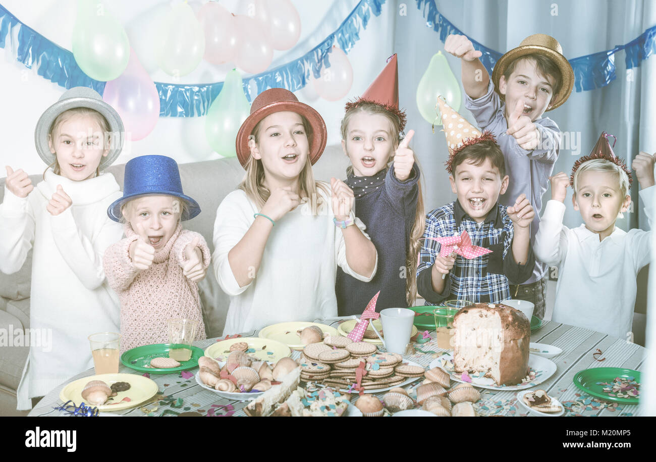 Cheerful children having party to celebrate friend’s birthday Stock ...