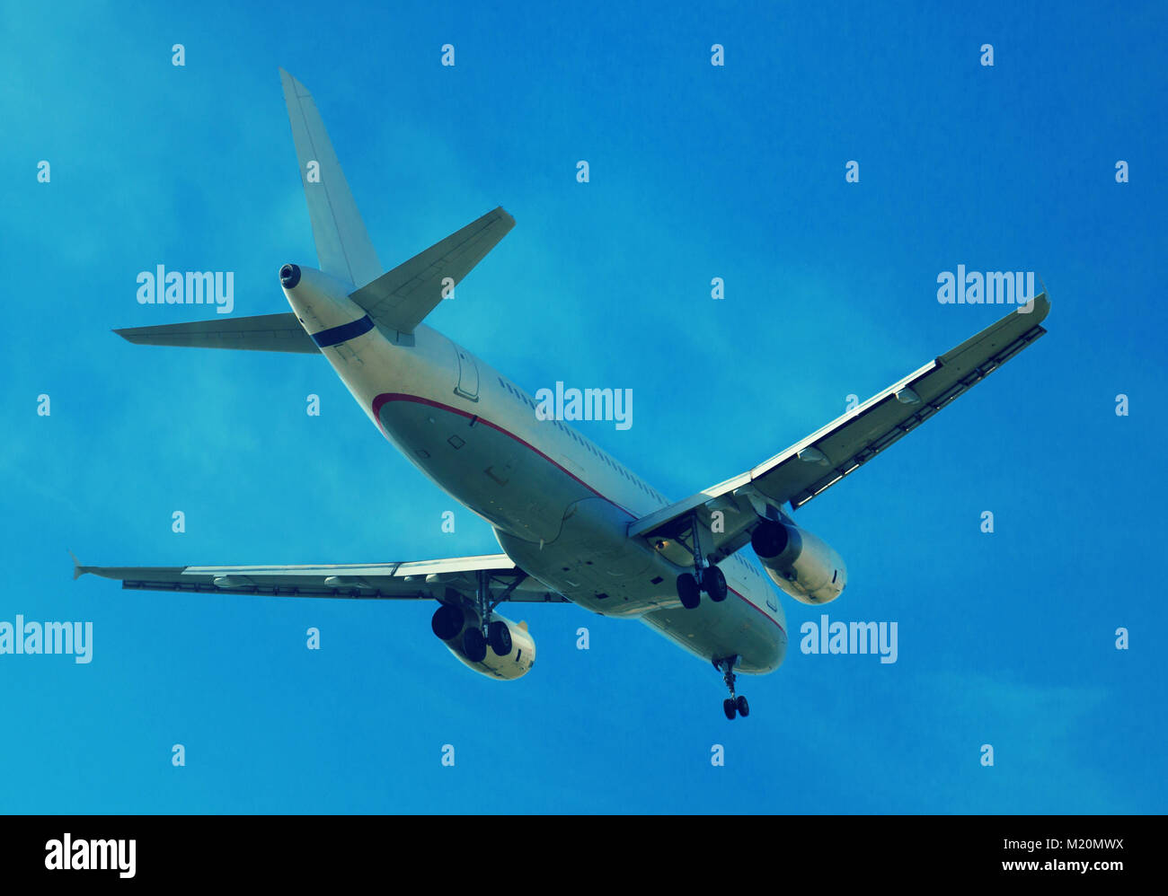 Large passenger airplane taking off from airport during day Stock Photo ...
