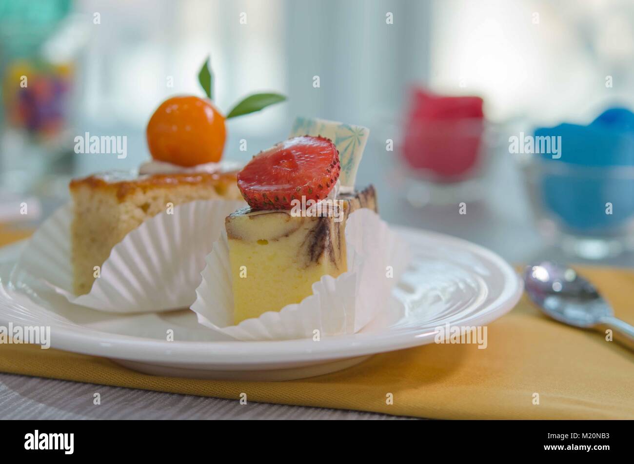 Cake cut into pieces on the table Stock Photo - Alamy
