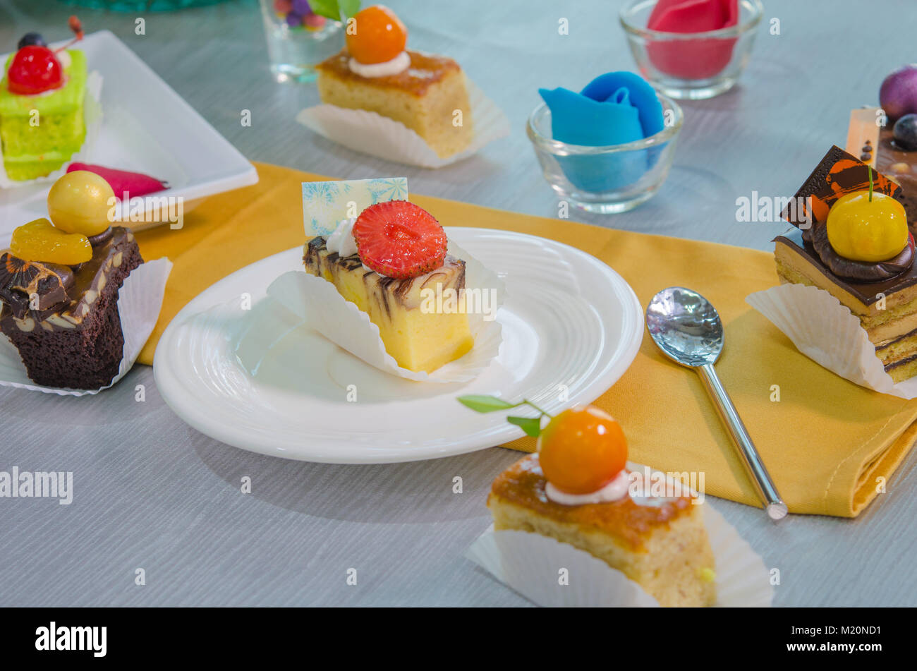 Cake cut into pieces on the table Stock Photo - Alamy
