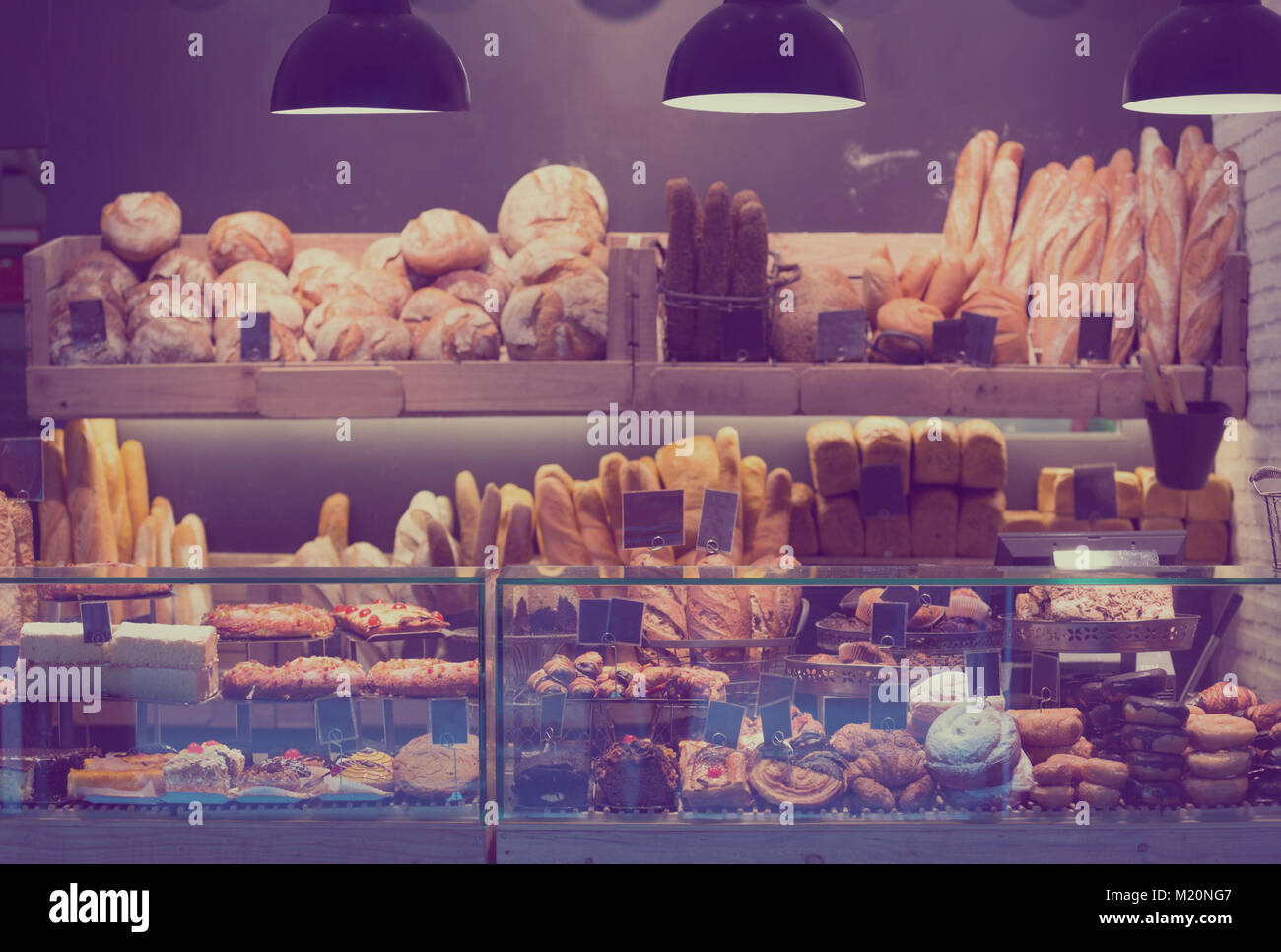 Modern bakery with different kinds of bread, cakes and buns Stock Photo ...