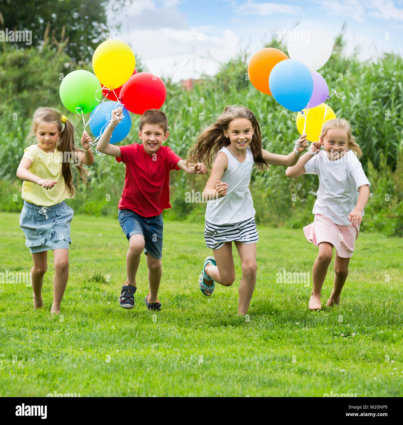 Girl happily running outdoors hi-res stock photography and images - Alamy