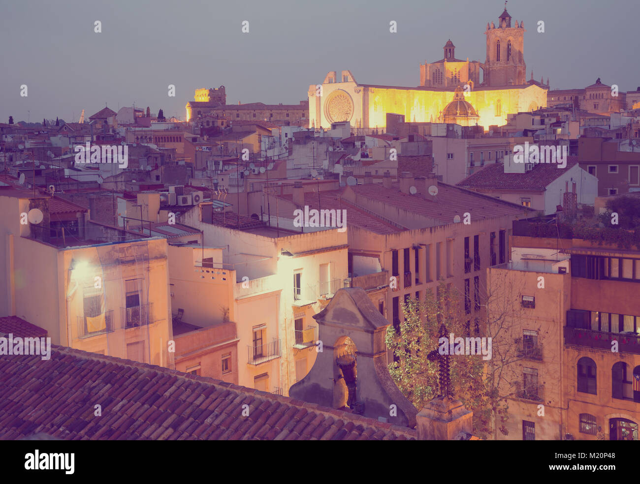 General view of Catalan city with Cathedral in evening. Tarragona ...